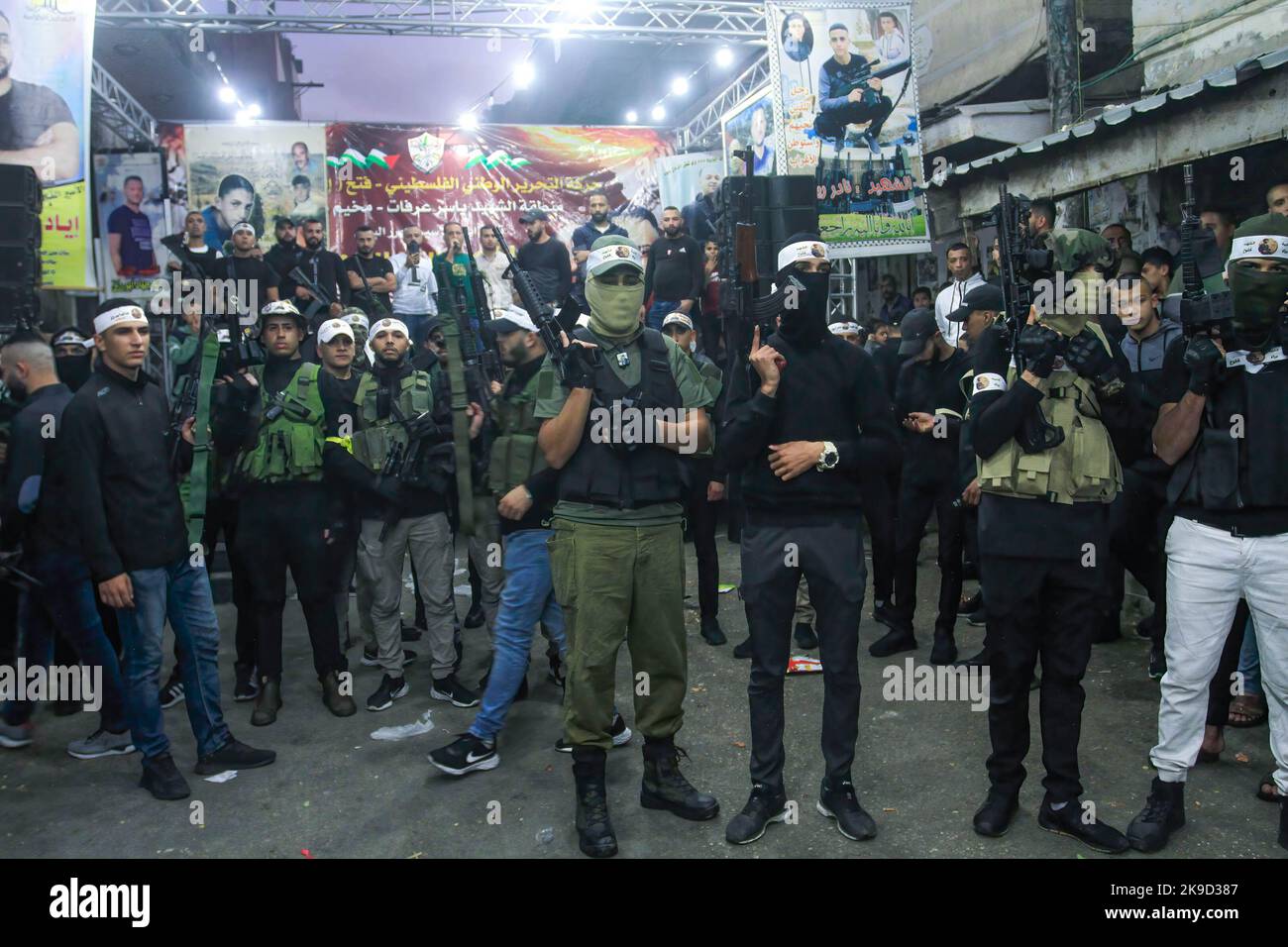 Masked Palestinian gunmen appeared carrying their weapons while ...