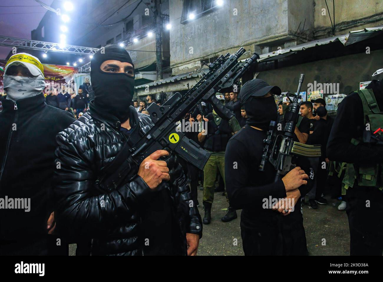 Masked Palestinian gunmen appeared carrying their weapons while ...