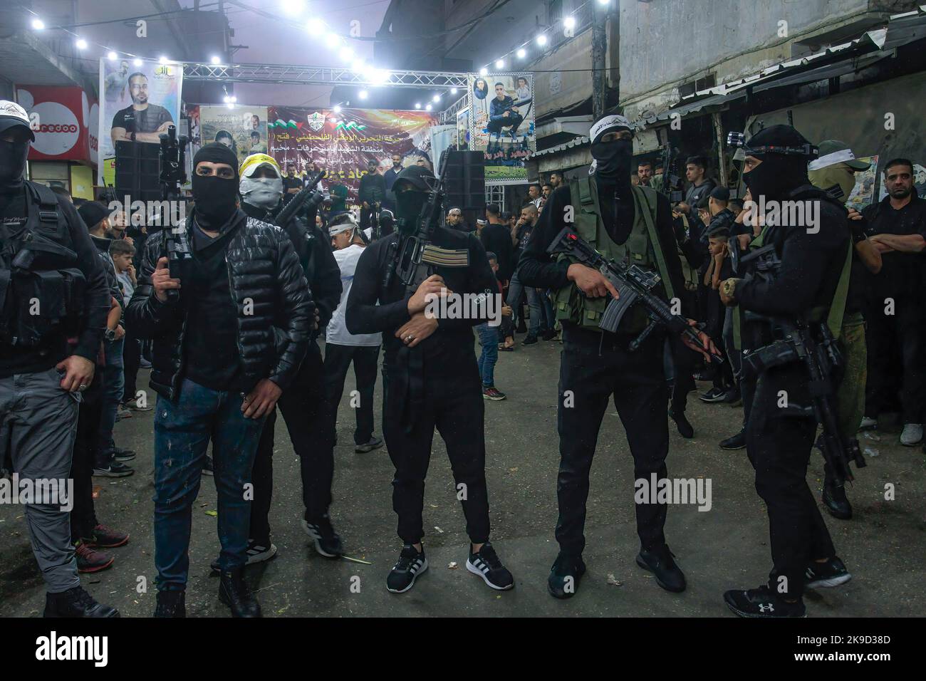 Masked Palestinian gunmen appeared carrying their weapons while ...