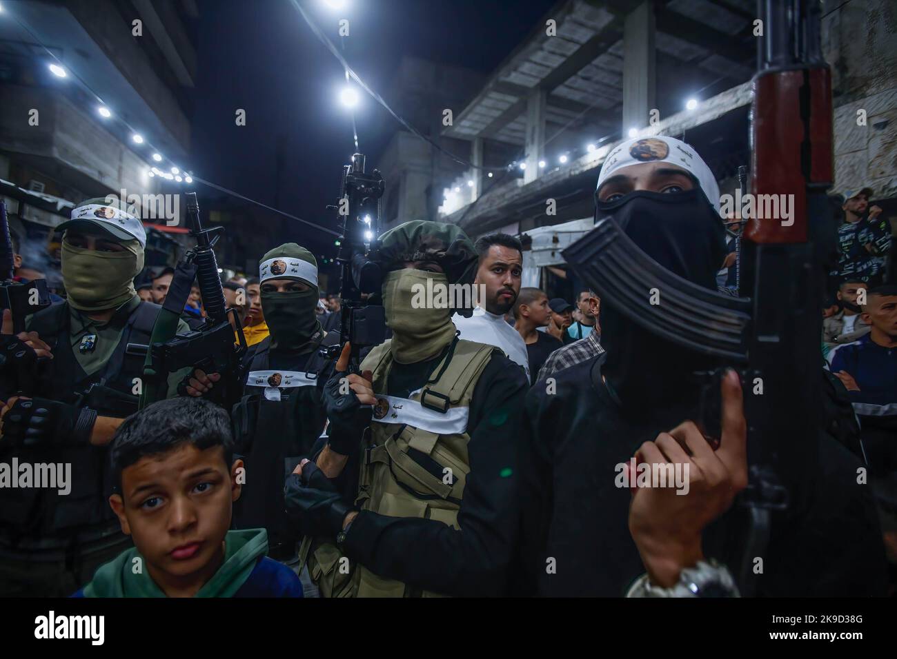 Masked Palestinian gunmen appeared carrying their weapons while ...