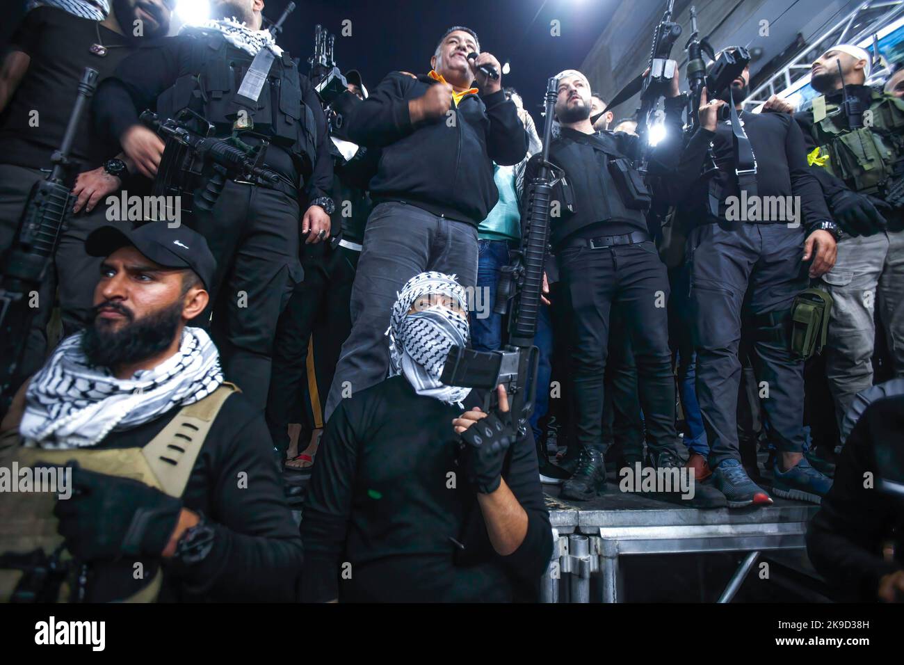 Masked Palestinian gunmen appeared carrying their weapons while ...