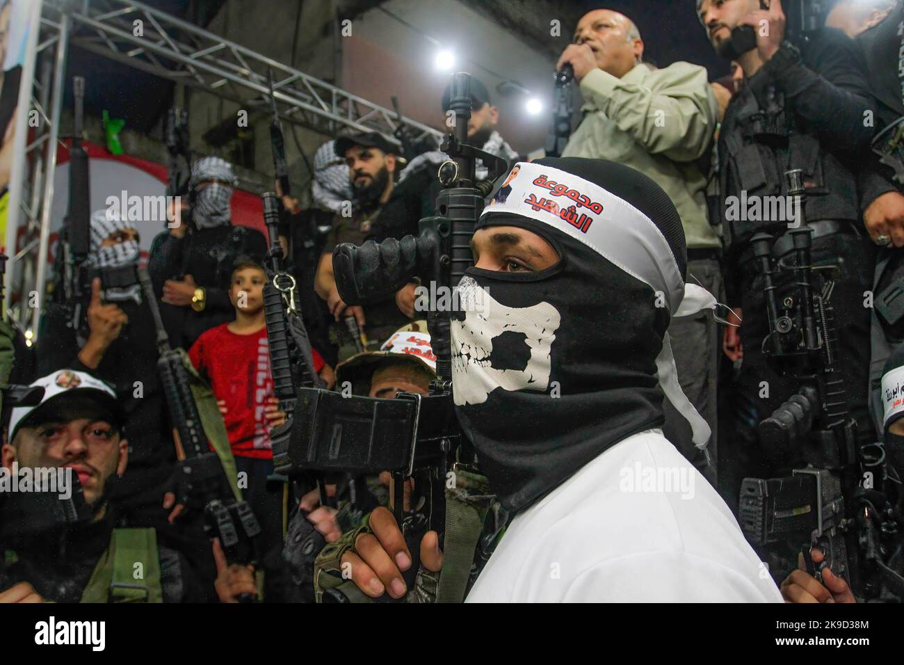 Masked Palestinian gunmen appeared carrying their weapons while ...