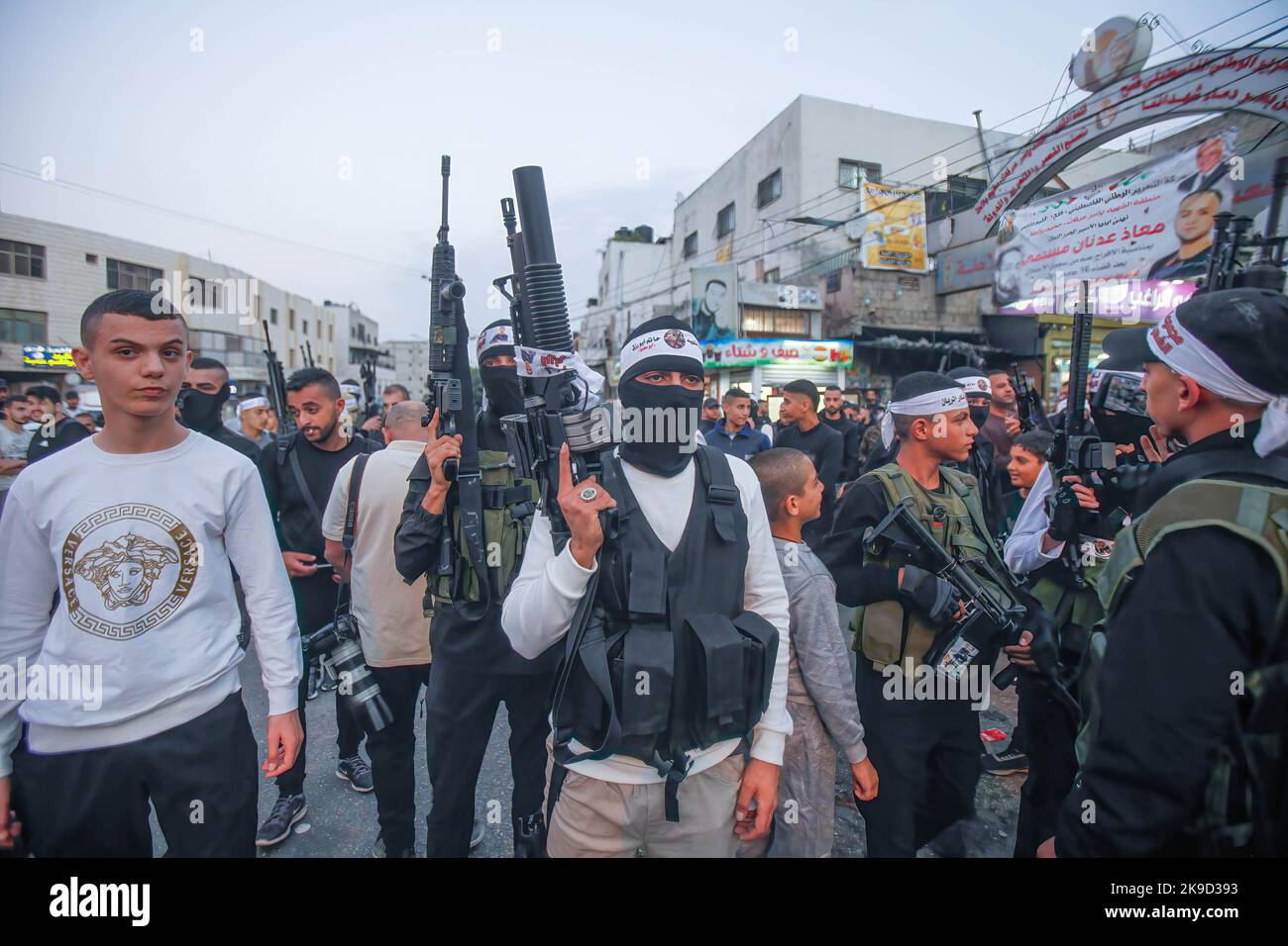 Masked Palestinian gunmen appeared carrying their weapons while ...