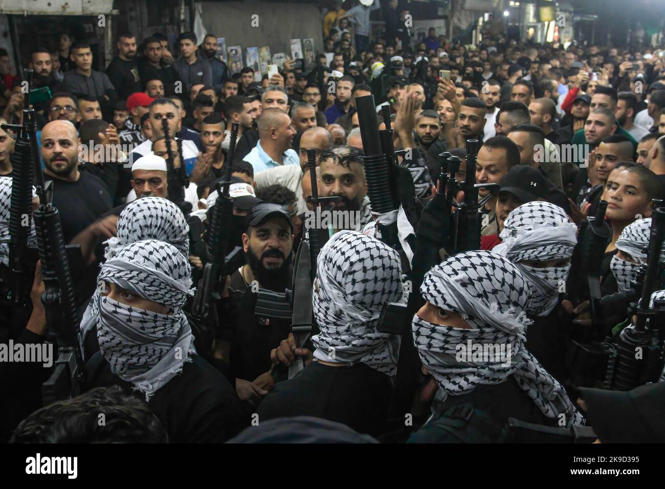 Masked Palestinian gunmen appeared carrying their weapons while ...