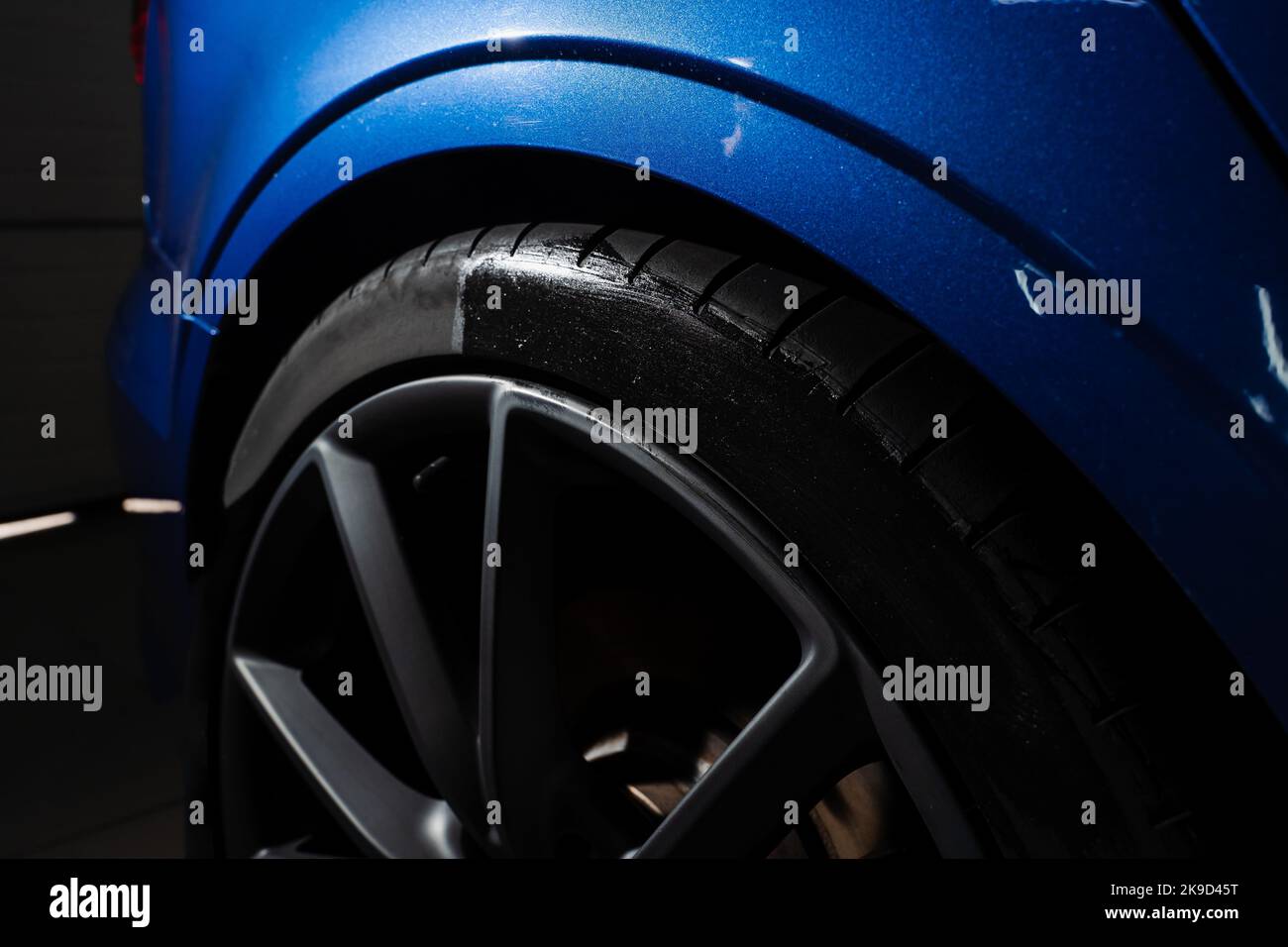 Blackening of tire wheel of car using sponge with chemical blackening ...
