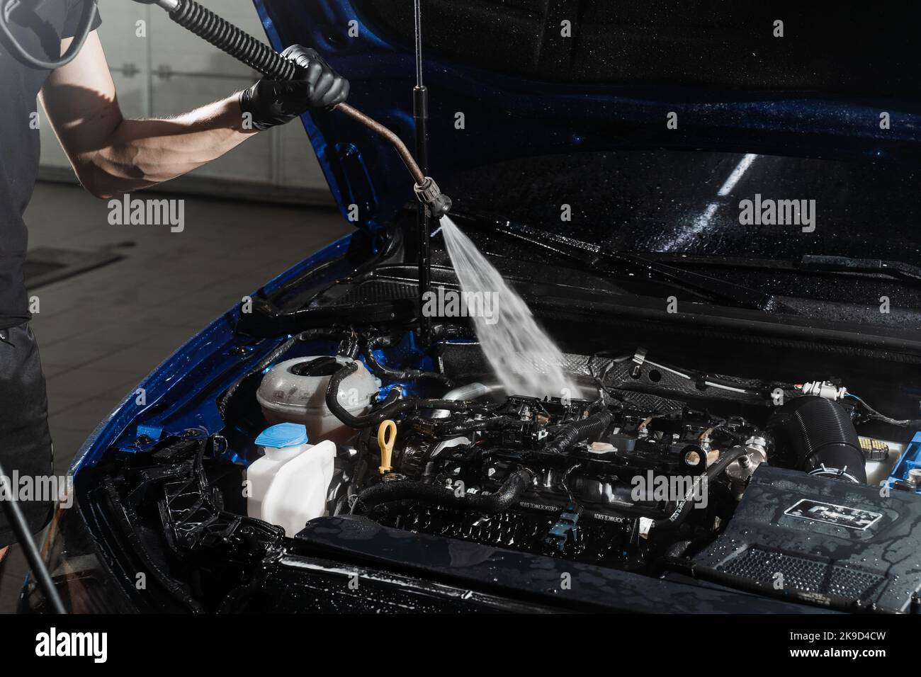 Washing car engine with with water in detailing auto service. Detailing ...
