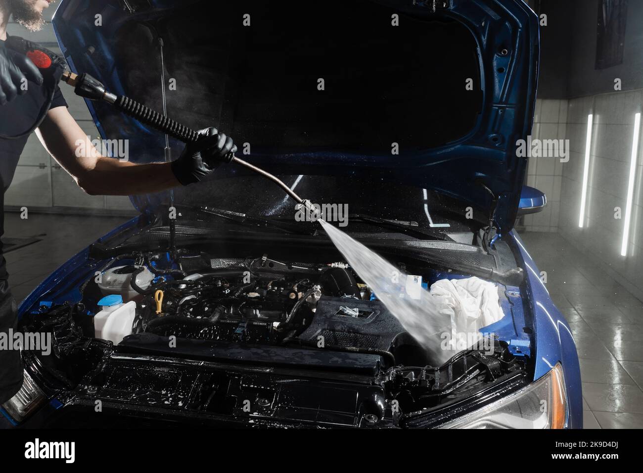 Washing car engine with with water in detailing auto service. Detailing ...