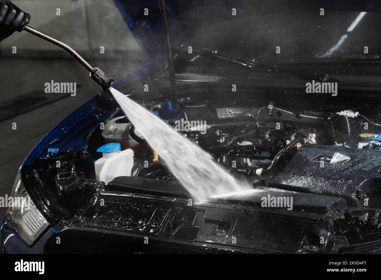 Washing car engine with with water in detailing auto service. Detailing ...