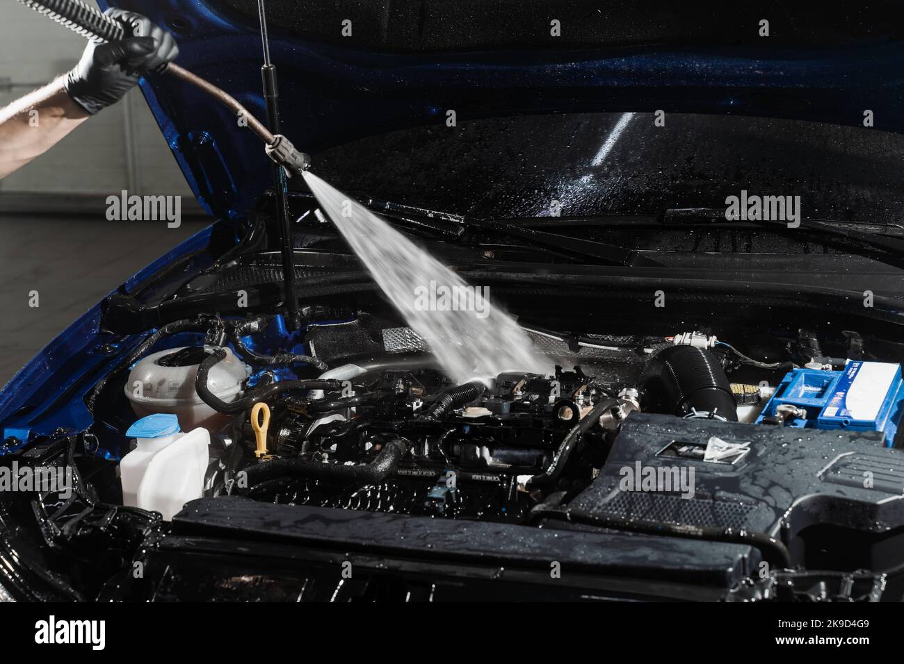 Washing car engine with with water in detailing auto service. Detailing ...