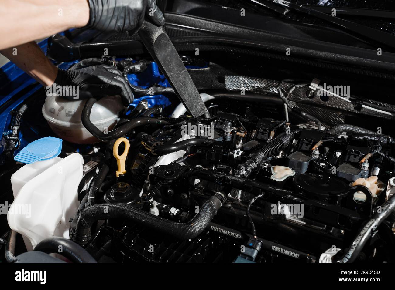 Process of drying car engine after washing with water and chemical ...
