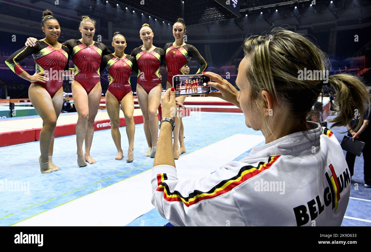 Belgian gymnastic coach Marjorie Heuls takes a picture of the team ...
