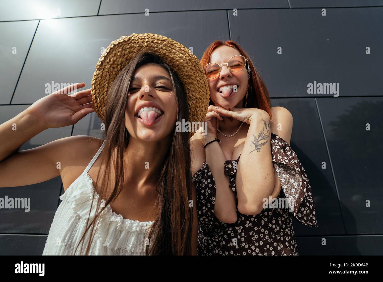 Two attractive young women fooling around in fresh air Stock Photo - Alamy