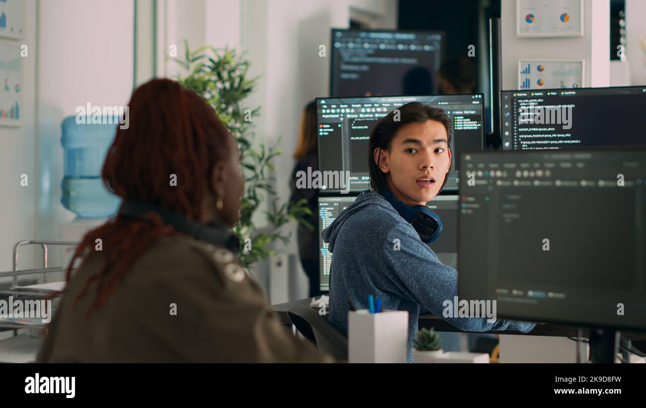 Software developer asking coder hi-res stock photography and images - Alamy