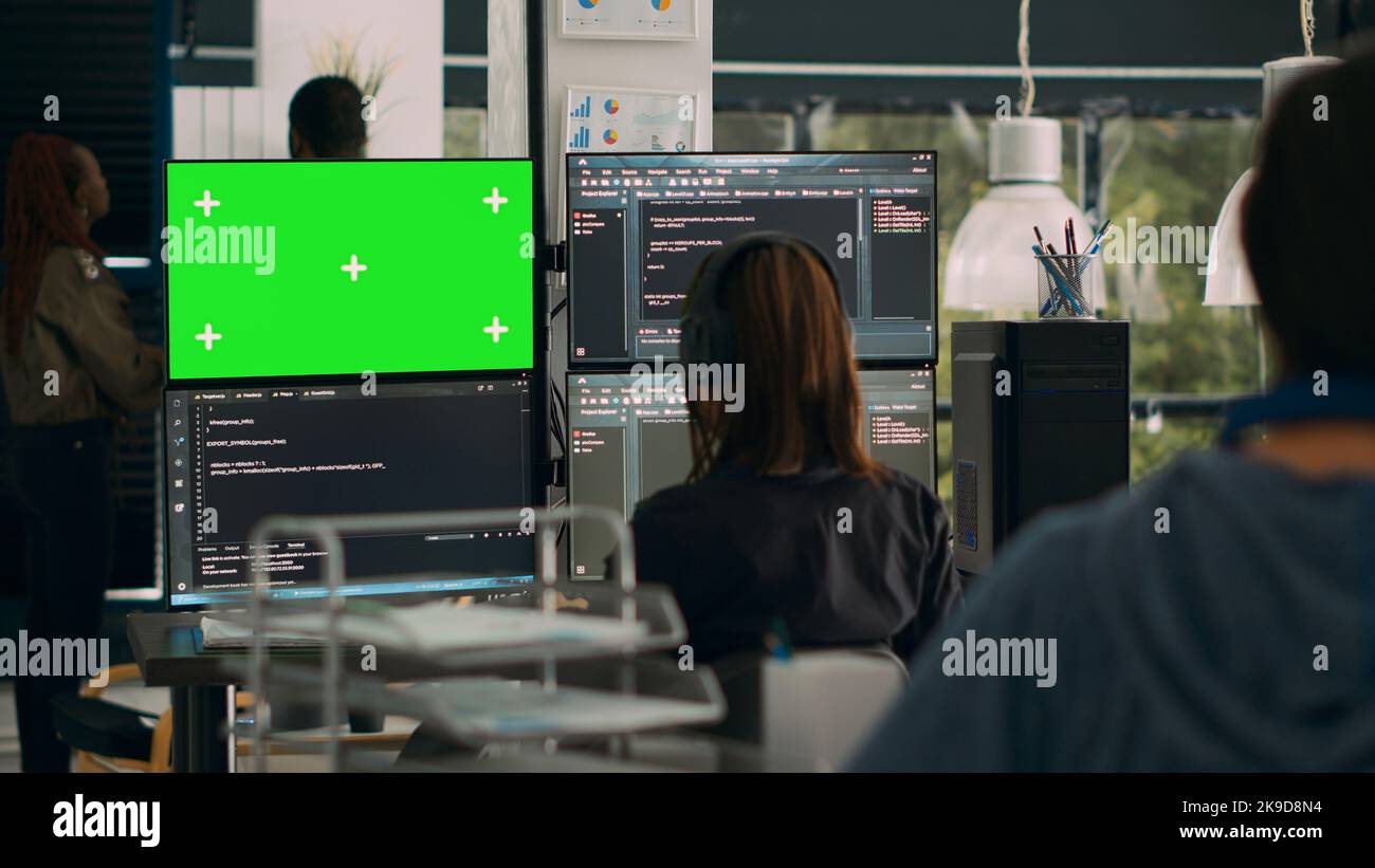Woman Programer Looking At Greenscreen And Code On Terminal Window Working With Chromakey 