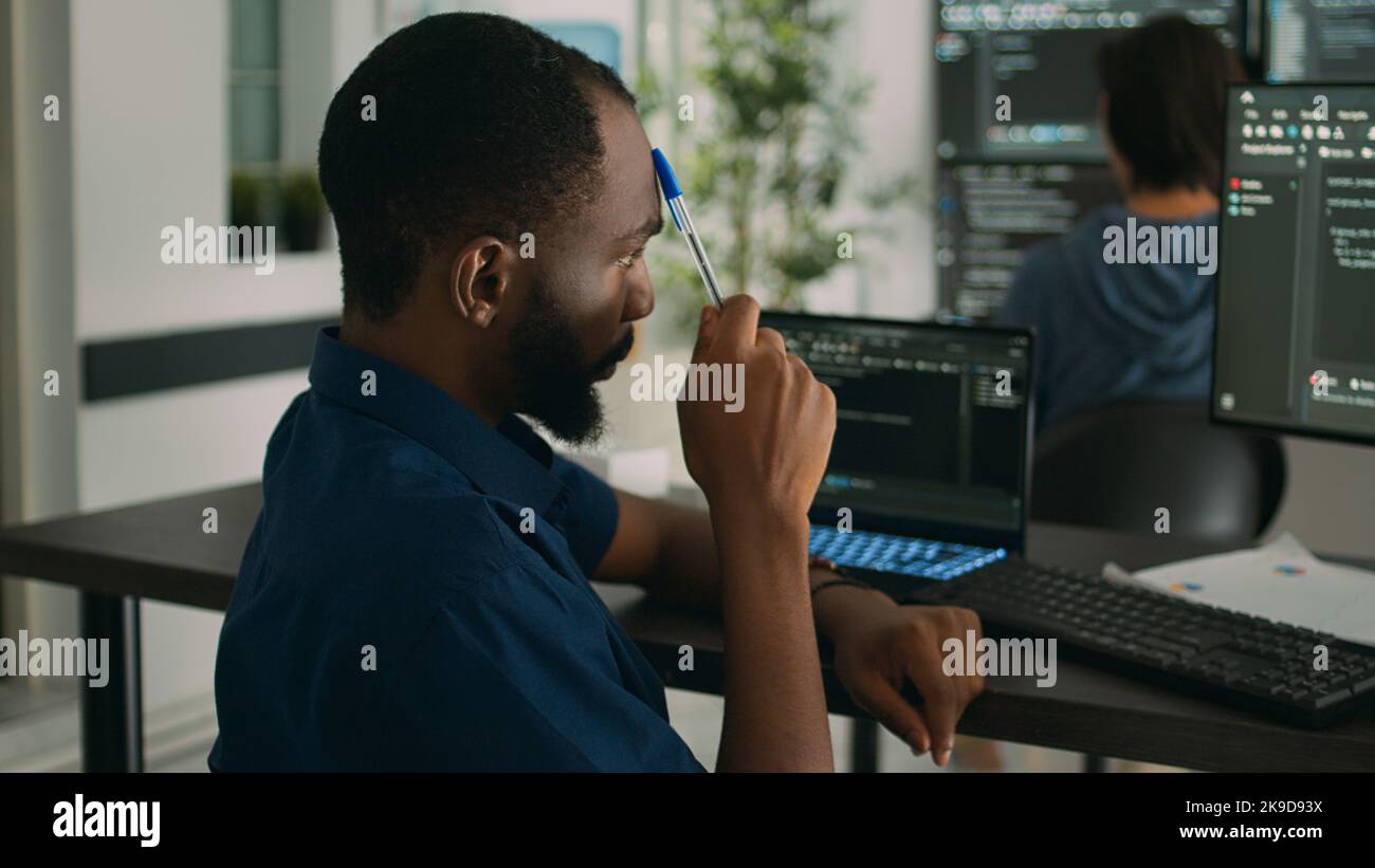 African american system engineer thinking about html script development ...