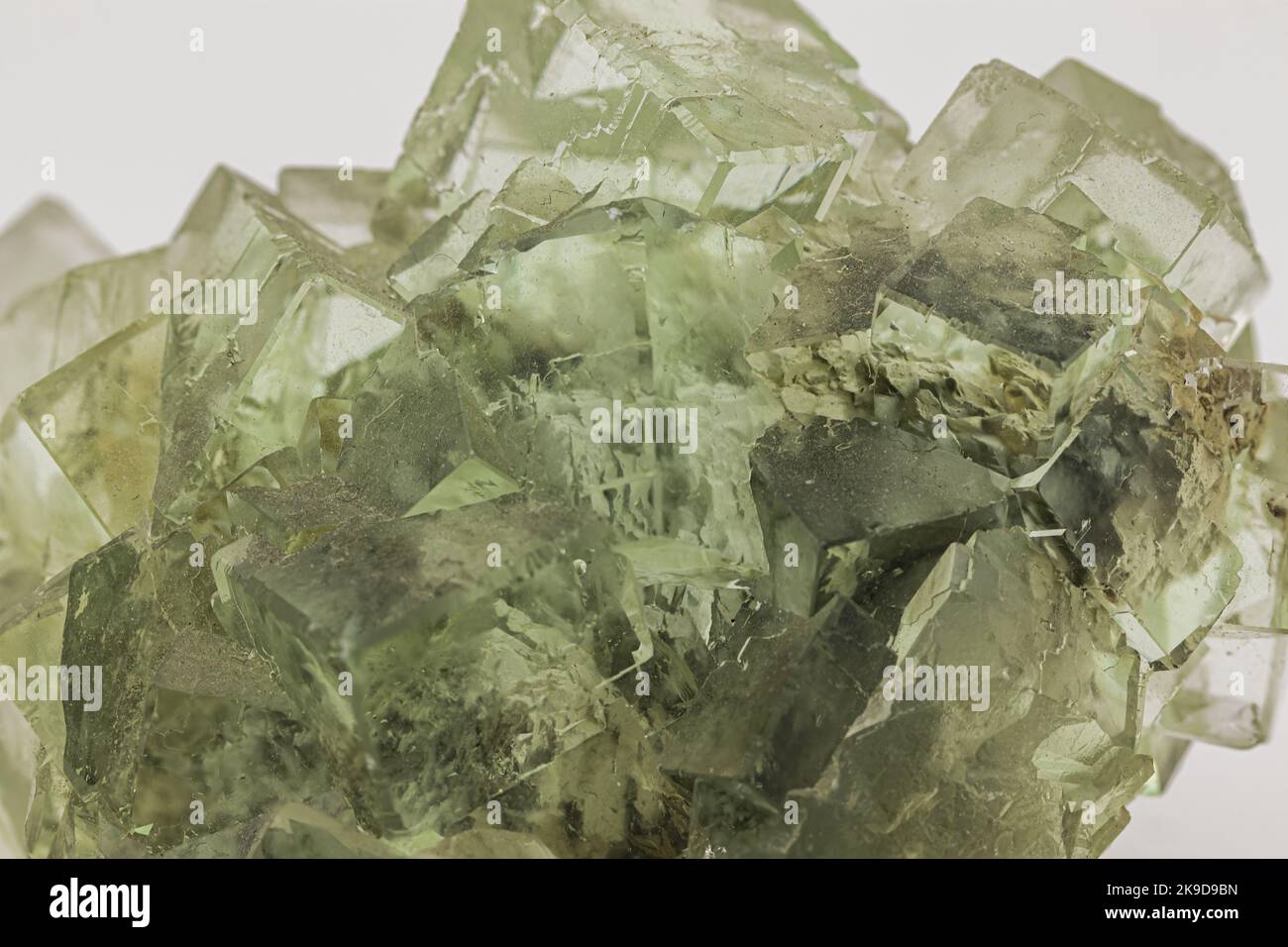mineral sample of green fluorite on white background Stock Photo - Alamy