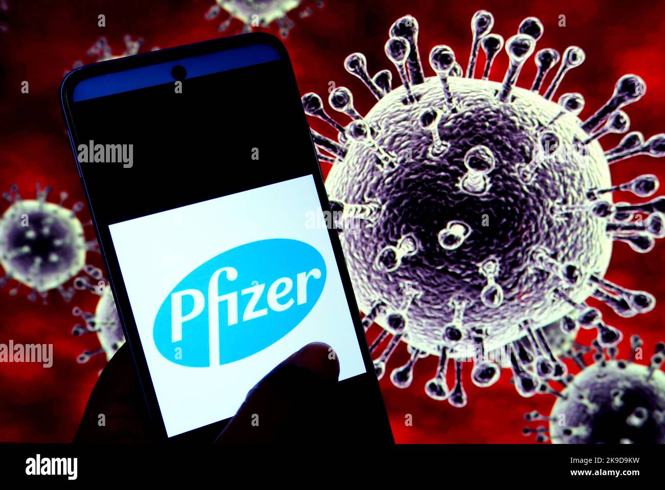 In this photo illustration, a Pfizer logo is displayed on a smartphone ...