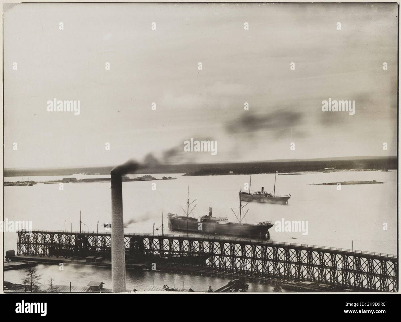 Construction of Svartön's first ore loading bridges Stock Photo - Alamy