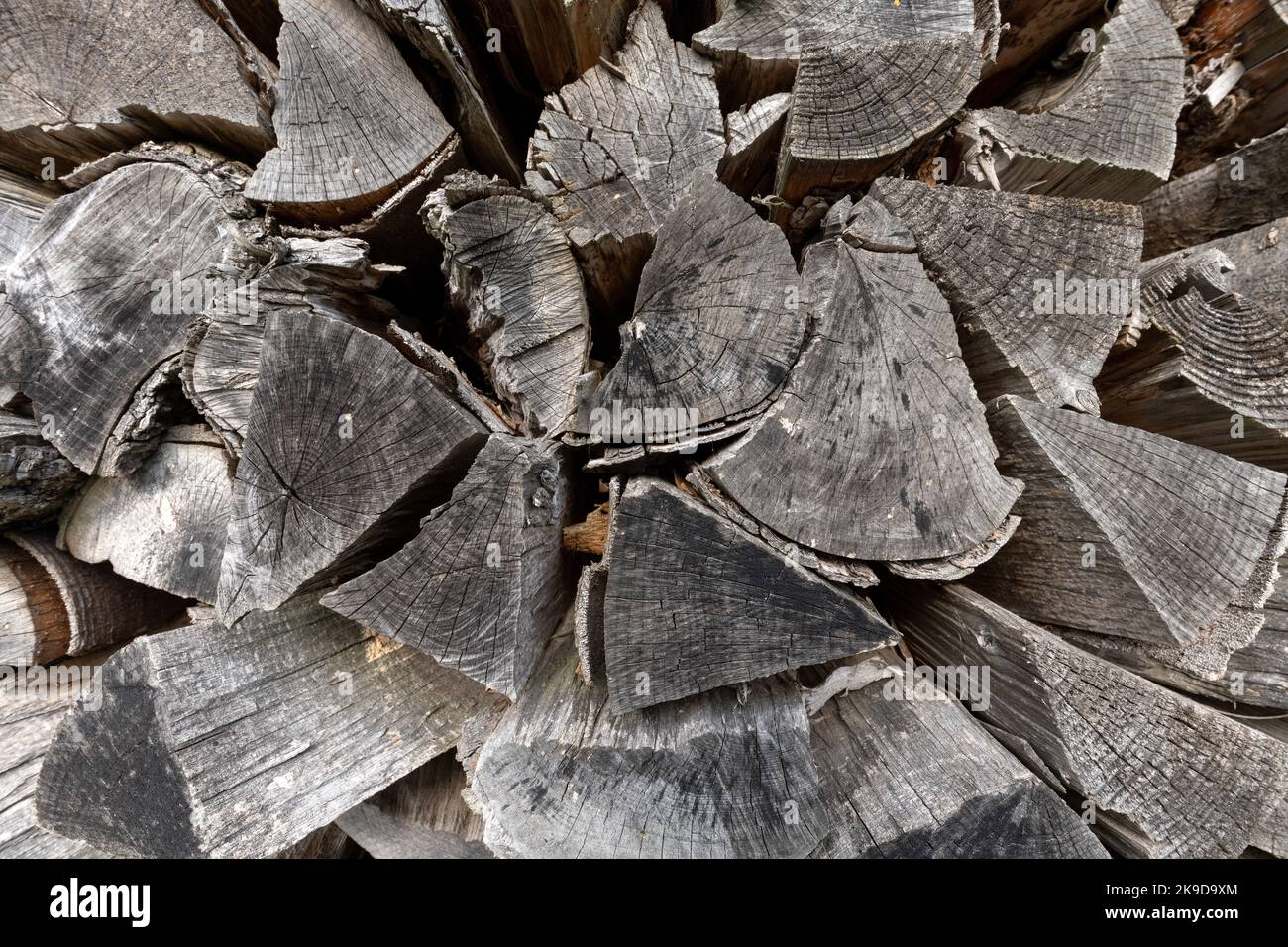 Firewood background - chopped firewood on a stack Stock Photo - Alamy