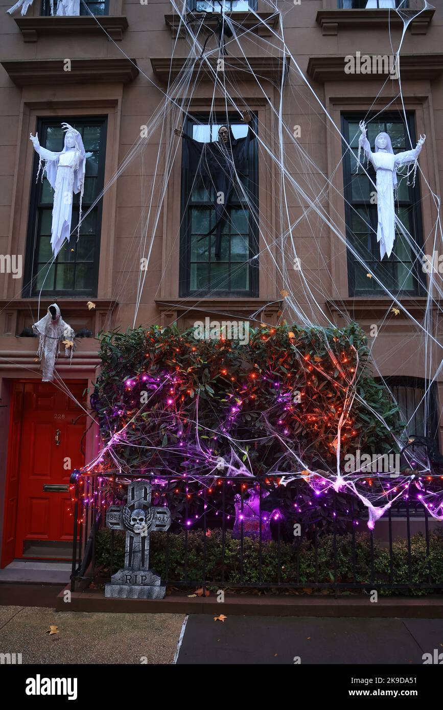 NEW YORK, NEW YORK - October 26, 2022: Ghosts hang outside of windows ...