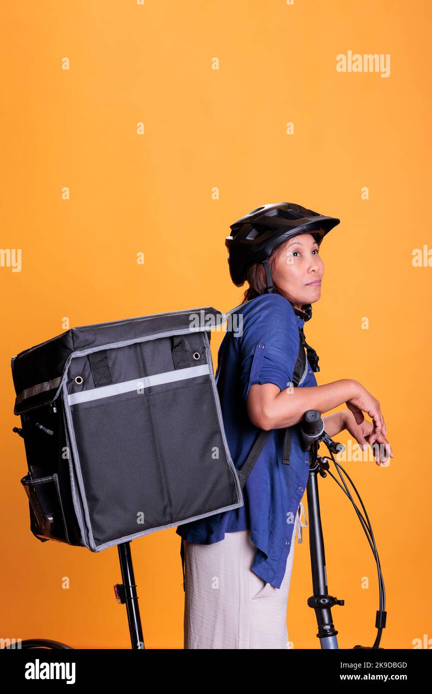 Restaurant courier carrying takeout food backpack delivering pizza meal ...