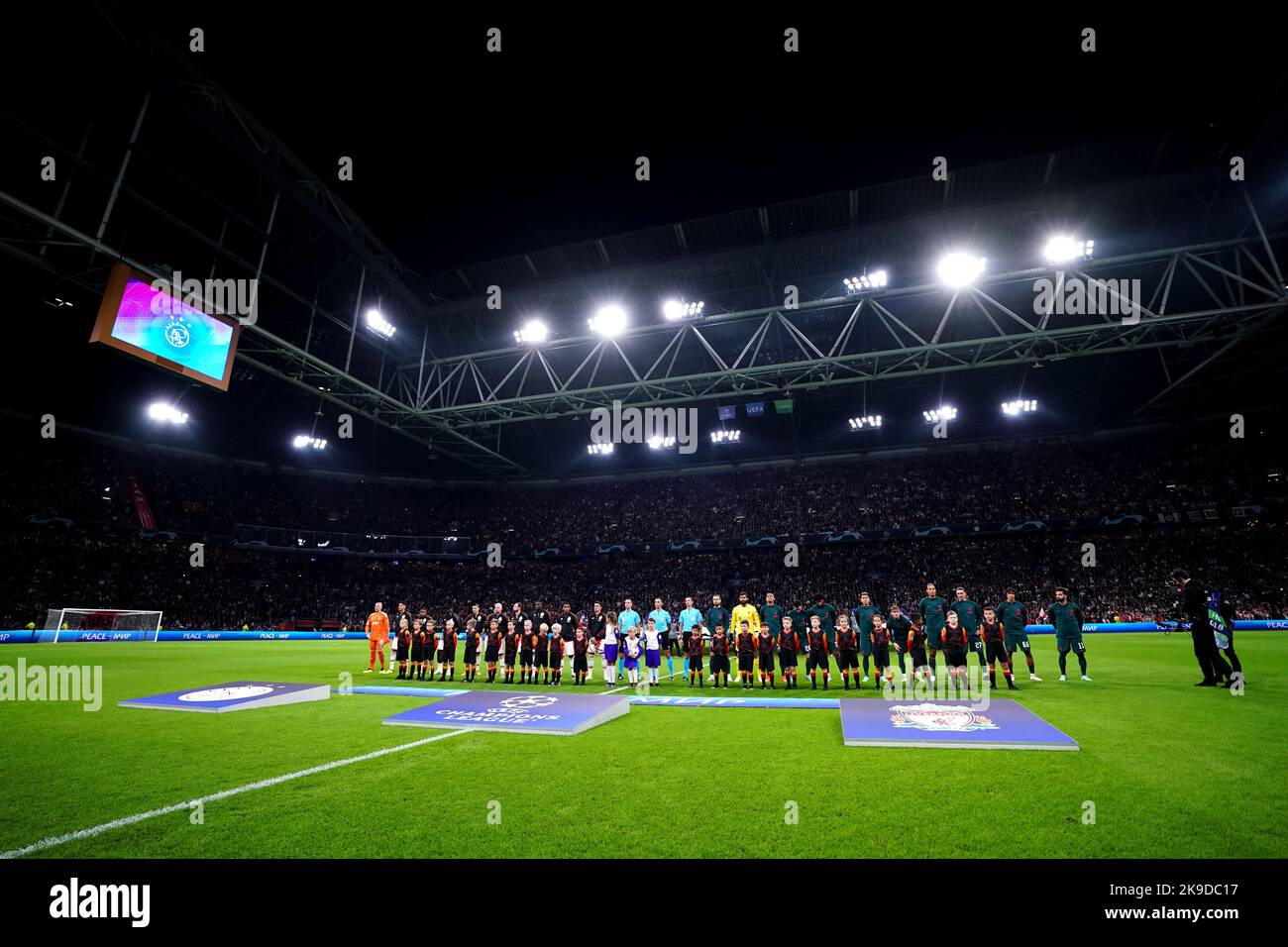 Players line up on the pitch ahead of the UEFA Champions League group A ...