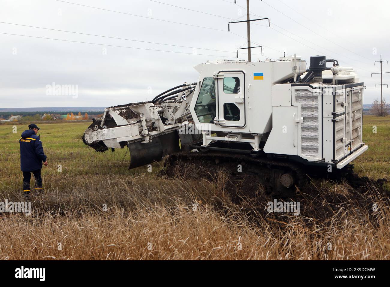 KHARKIV REGION, UKRAINE - OCTOBER 27, 2022 - A rescuer stands by an ...