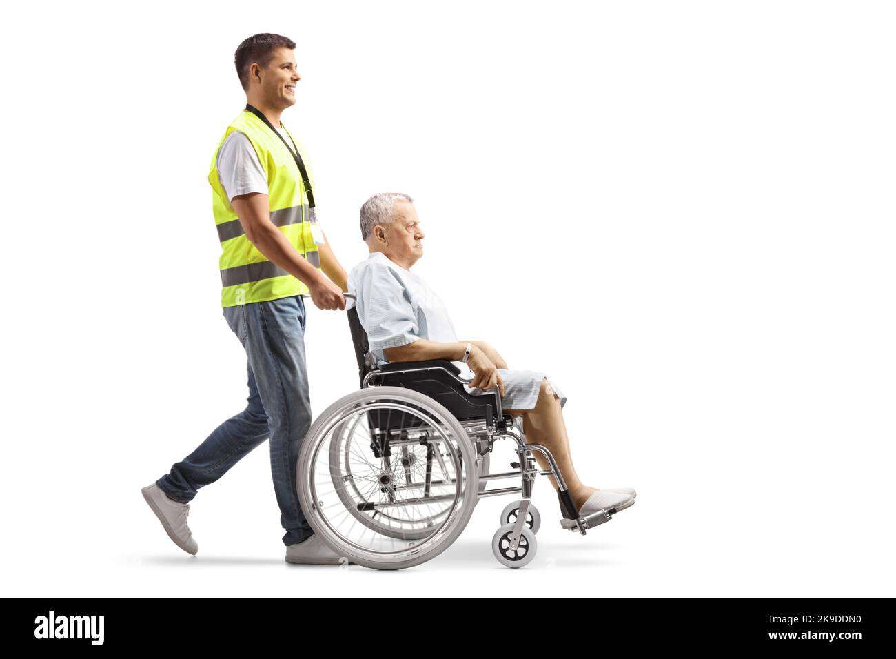 Full length profile shot of a hospital security worker pushing a ...