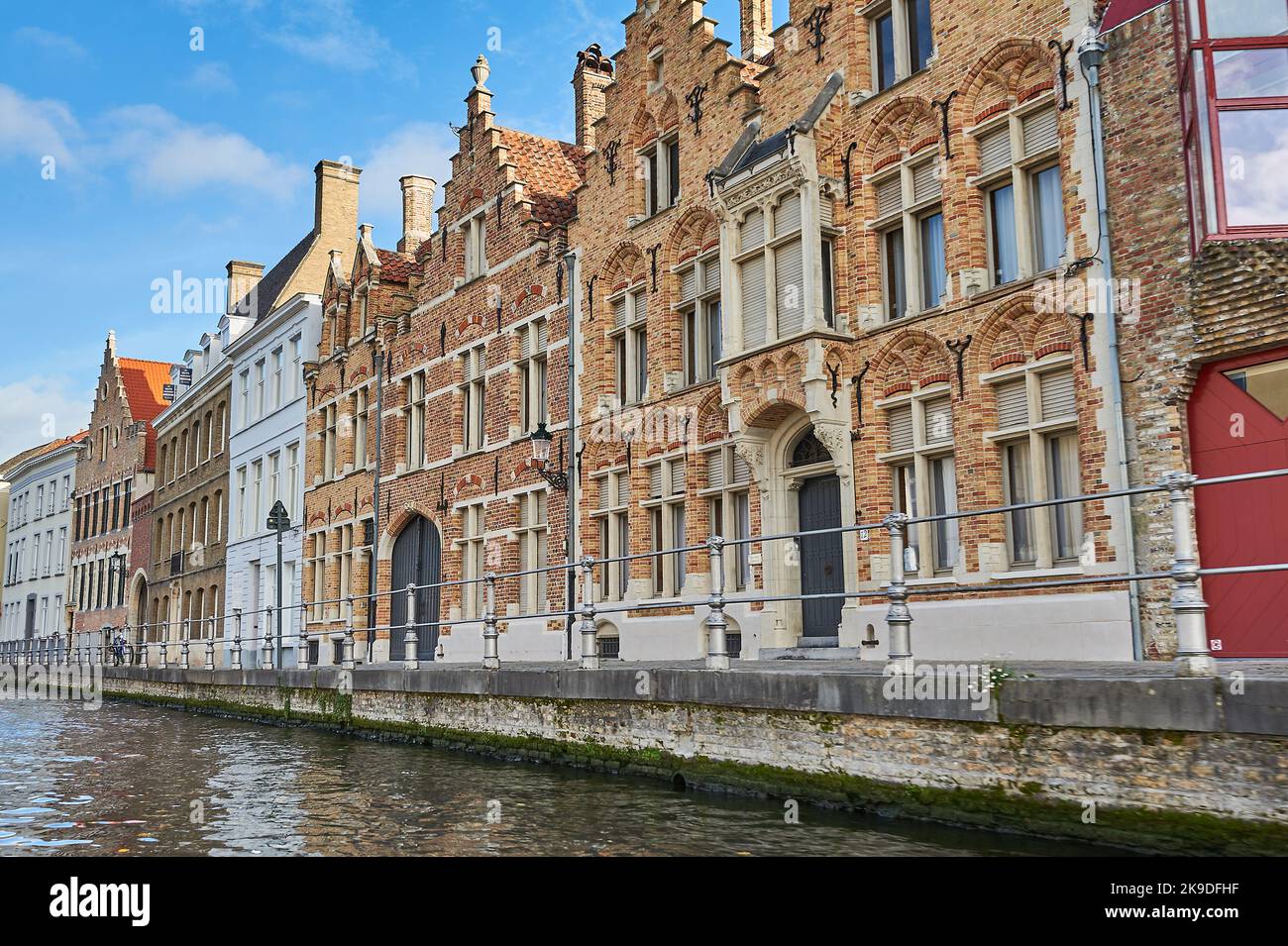Ornate Flemish architecture on buildings lining the Sint Annarei canal ...