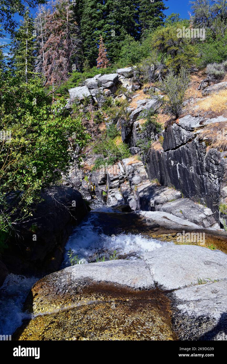 Horsetail Falls cascade down the cliffs in Lone Peak Wilderness along ...