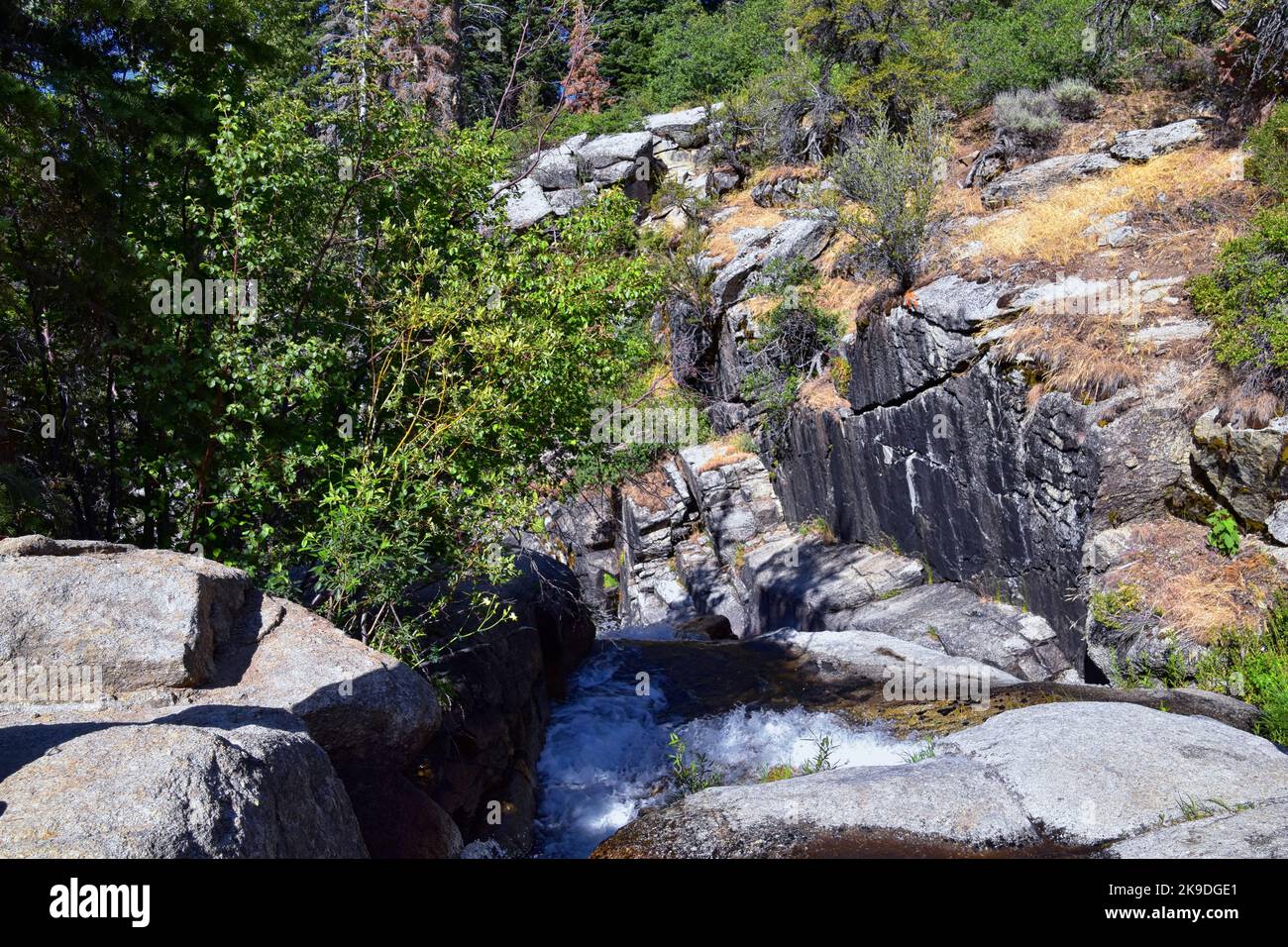 Horsetail Falls cascade down the cliffs in Lone Peak Wilderness along ...