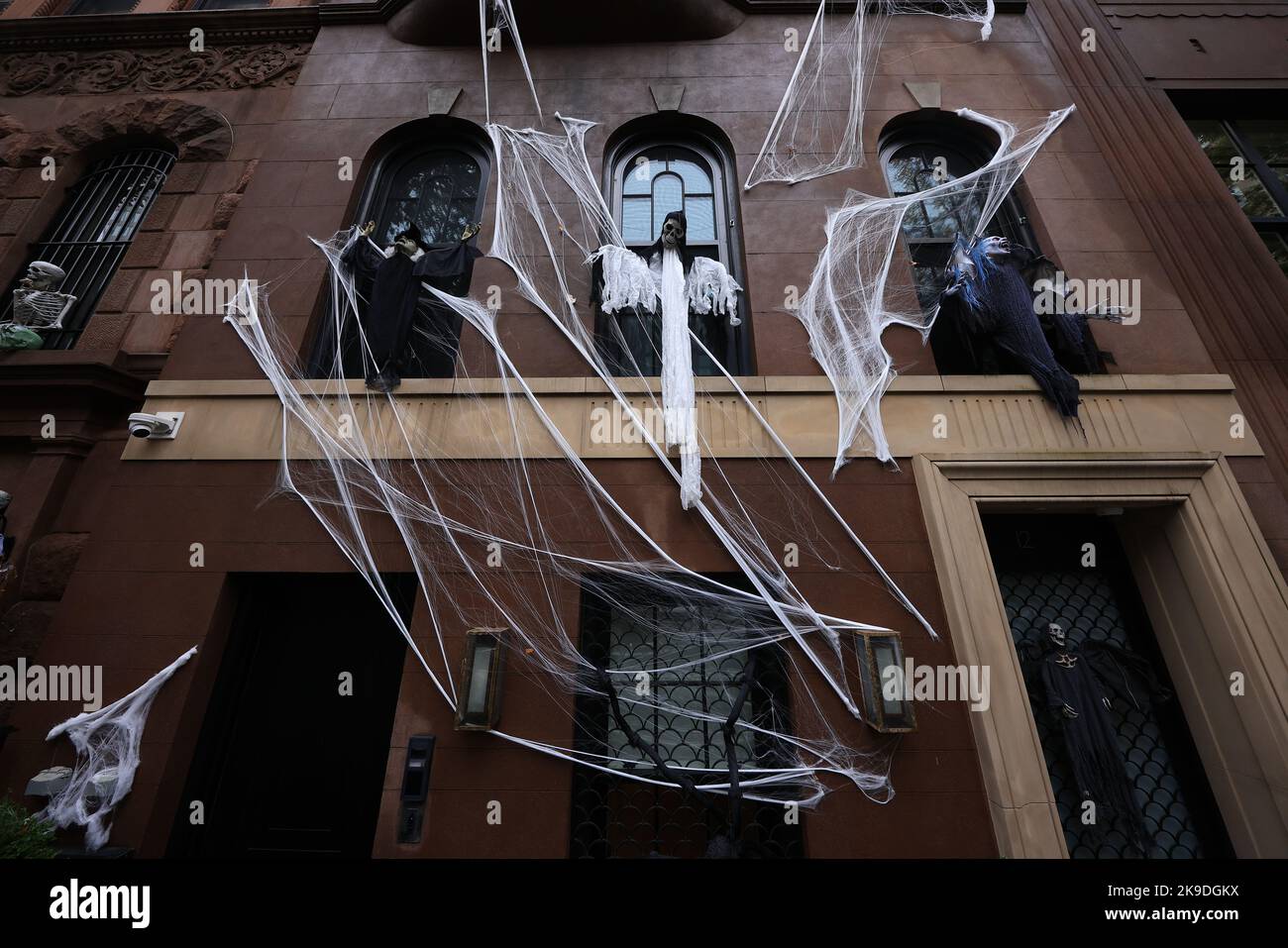 NEW YORK, NEW YORK - October 25, 2022: Ghosts hang outside of windows ...