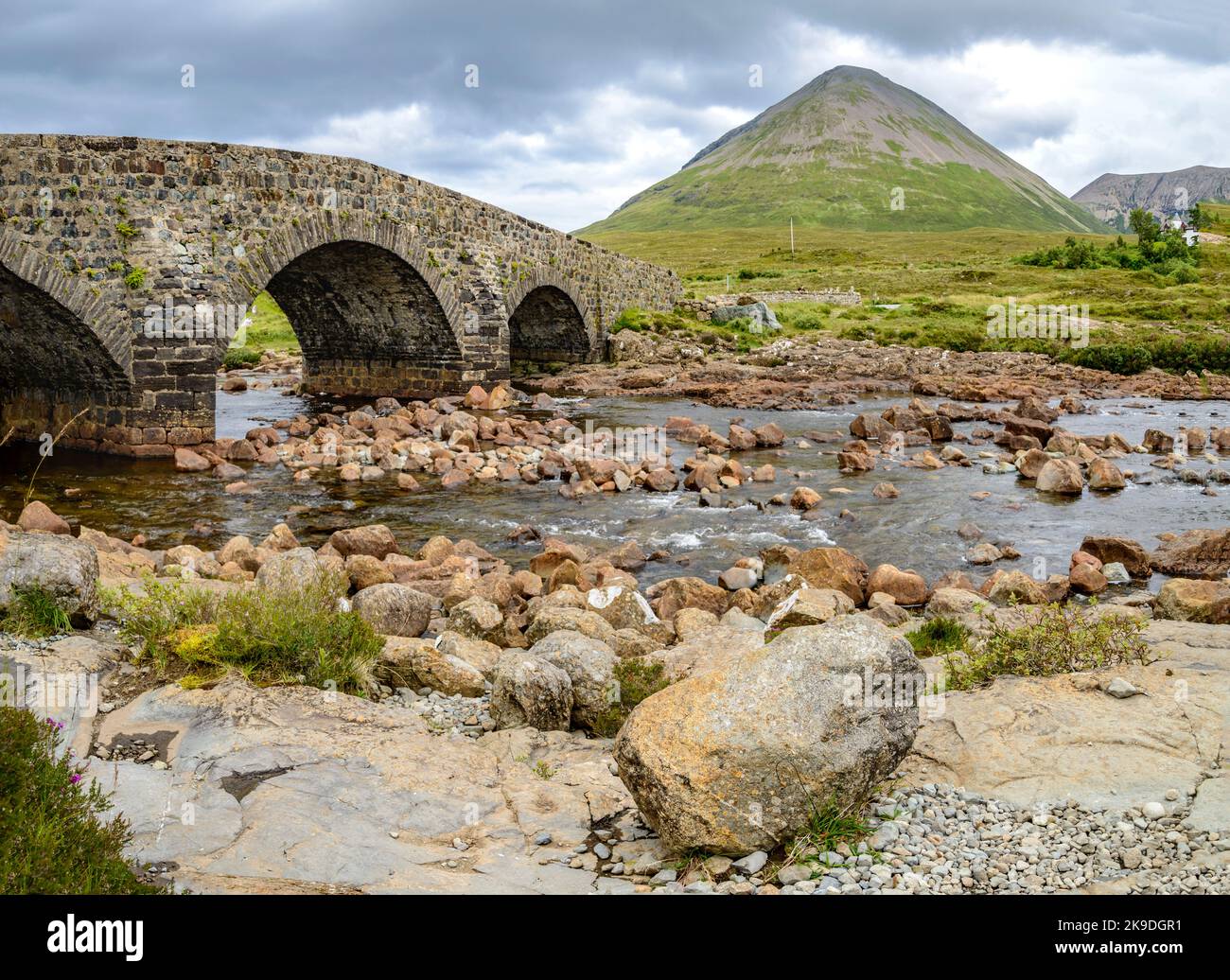 River waters running below the historic bridge into the nearby loch ...