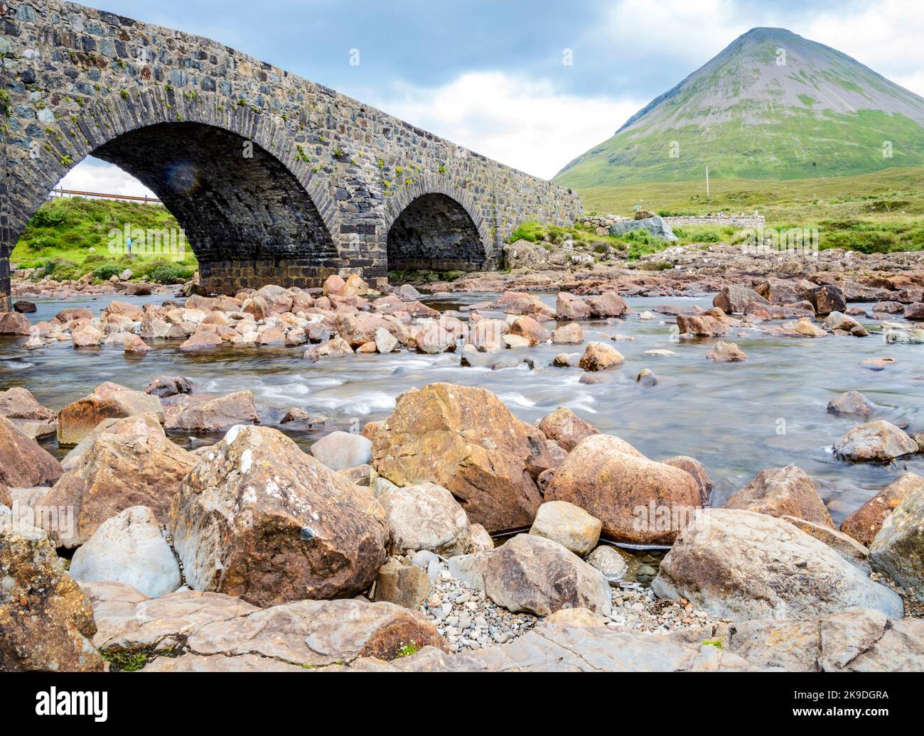 River waters running below the historic bridge into the nearby loch ...