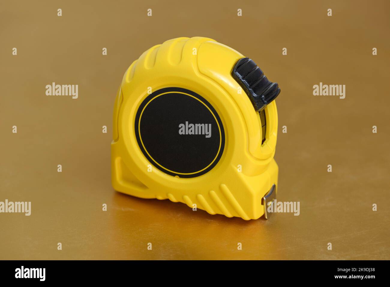 Yellow Measuring Tape on the golden background Stock Photo - Alamy