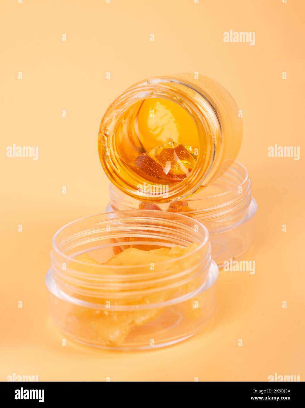 yellow cannabis wax in glass container, golden thc dab Stock Photo - Alamy