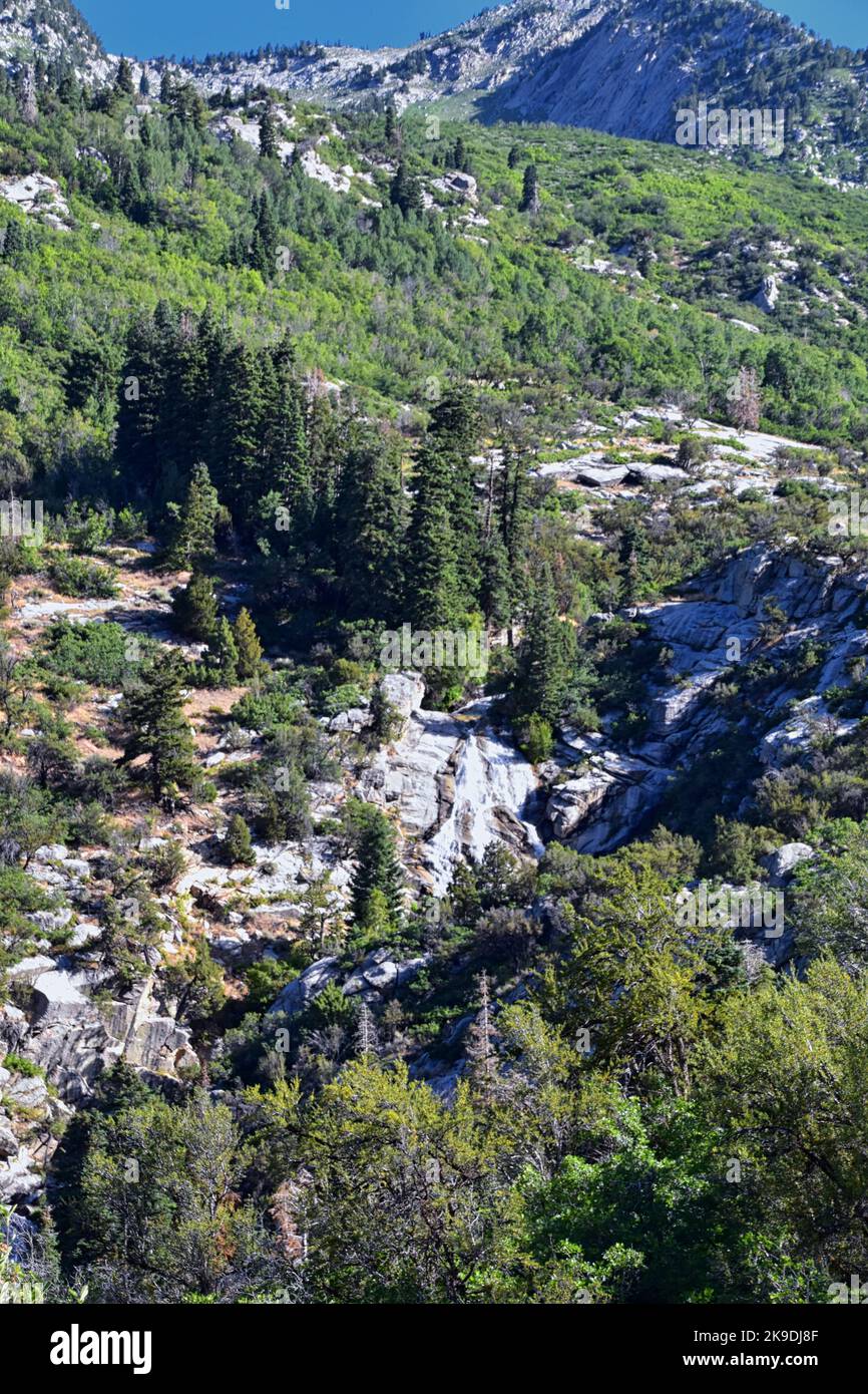 Horsetail Falls cascade down the cliffs in Lone Peak Wilderness along ...