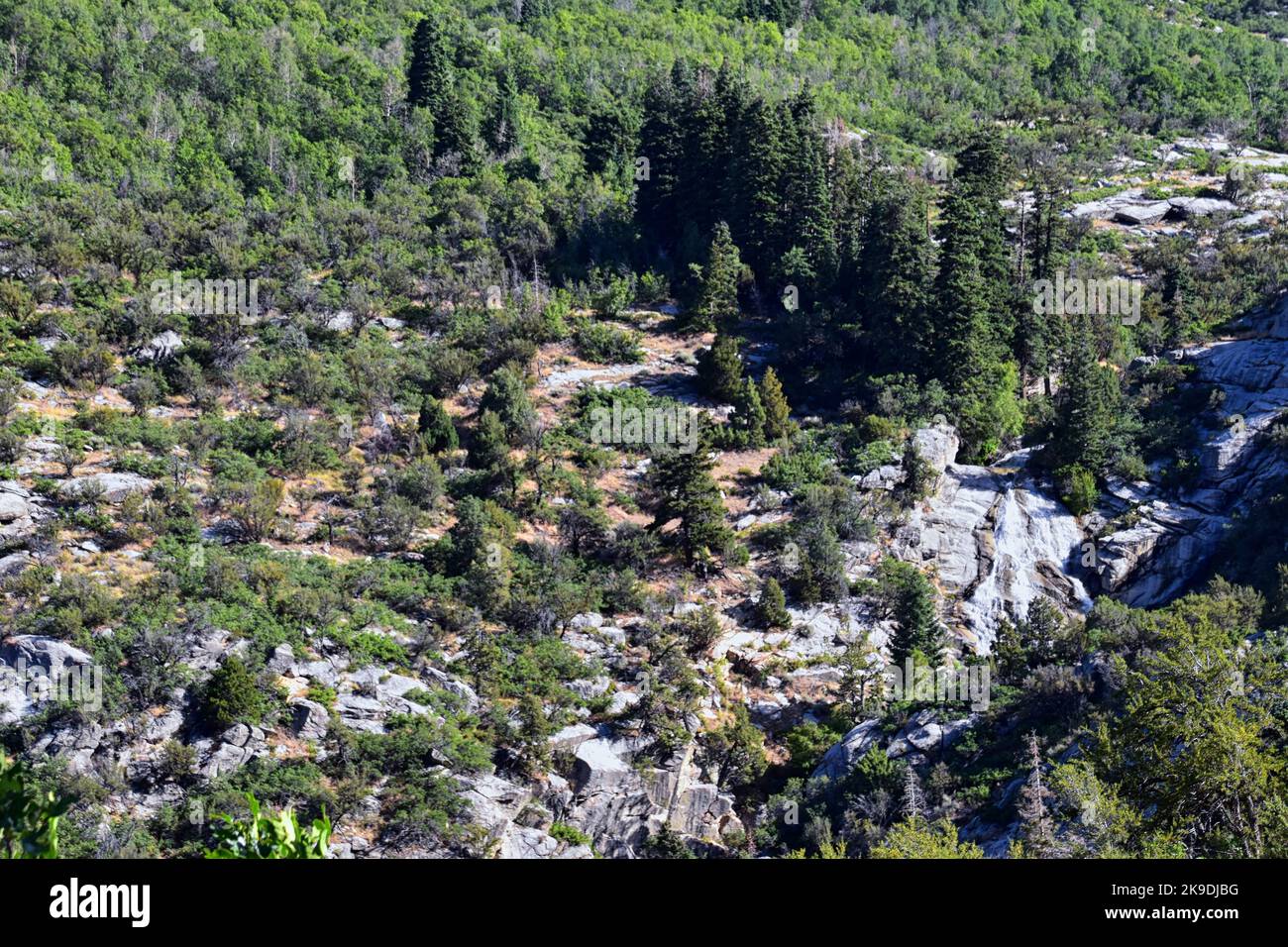 Horsetail Falls cascade down the cliffs in Lone Peak Wilderness along ...