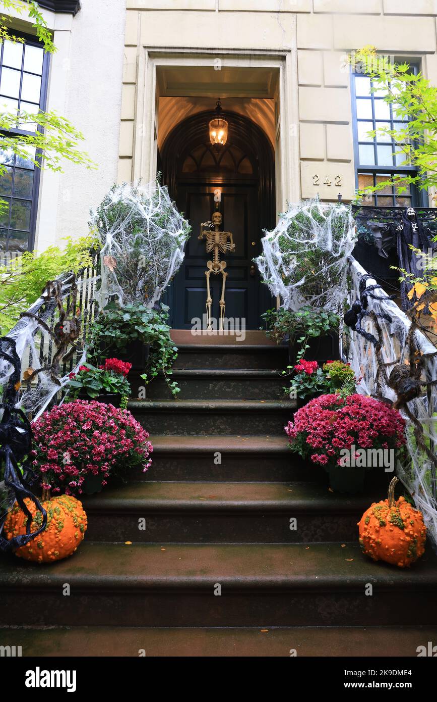 NEW YORK, NEW YORK - October 25, 2022: Cobwebs, pumpkins lead up the ...
