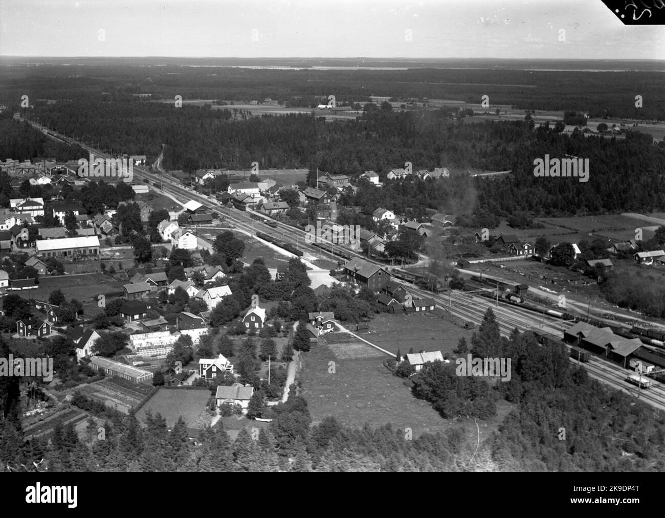 Brick building in middle Black and White Stock Photos & Images - Alamy