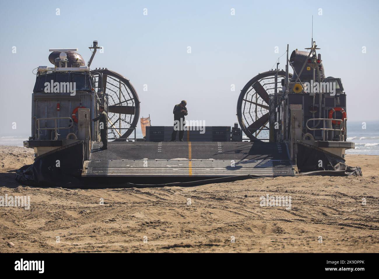 A landing craft, air cushion (LCAC) lands on Red Beach during Project ...