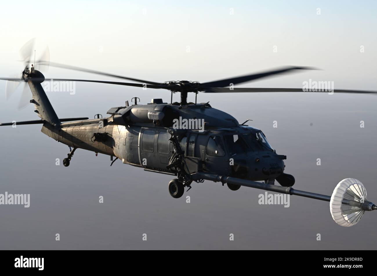 A U.S. Air Force HH-60G Pave Hawk receives fuel from a HC-130J Combat ...