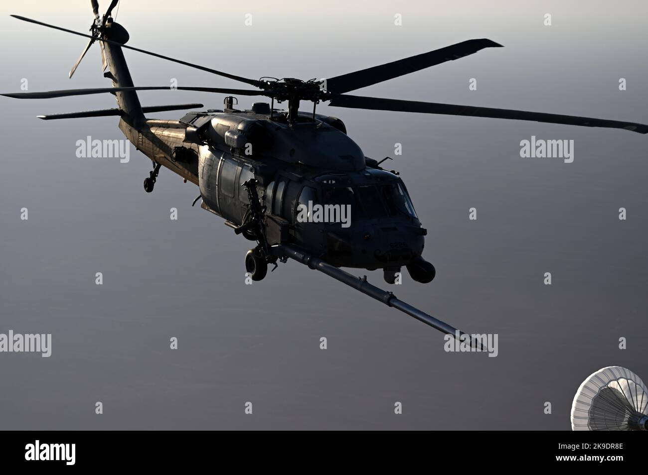 A U.S. Air Force HH-60G Pave Hawk prepares to receive fuel from a HC ...