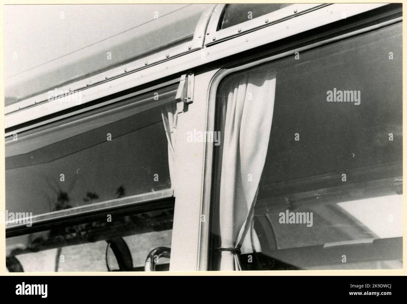 Window and curtain on bus seen from the outside Stock Photo - Alamy
