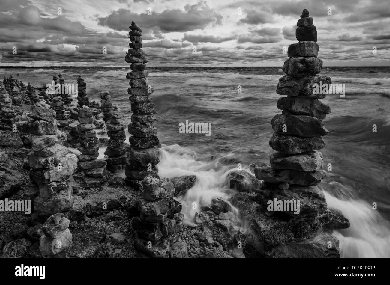Rock Cairns are piled high and thickly along the Lake Michigan shore ...