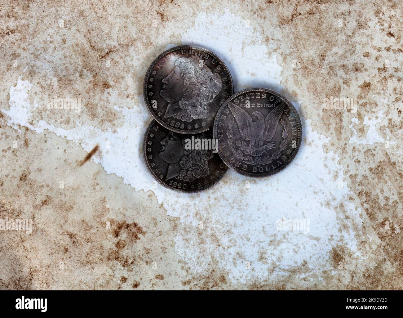 Vintage silver coins on faded paper texture background Stock Photo - Alamy