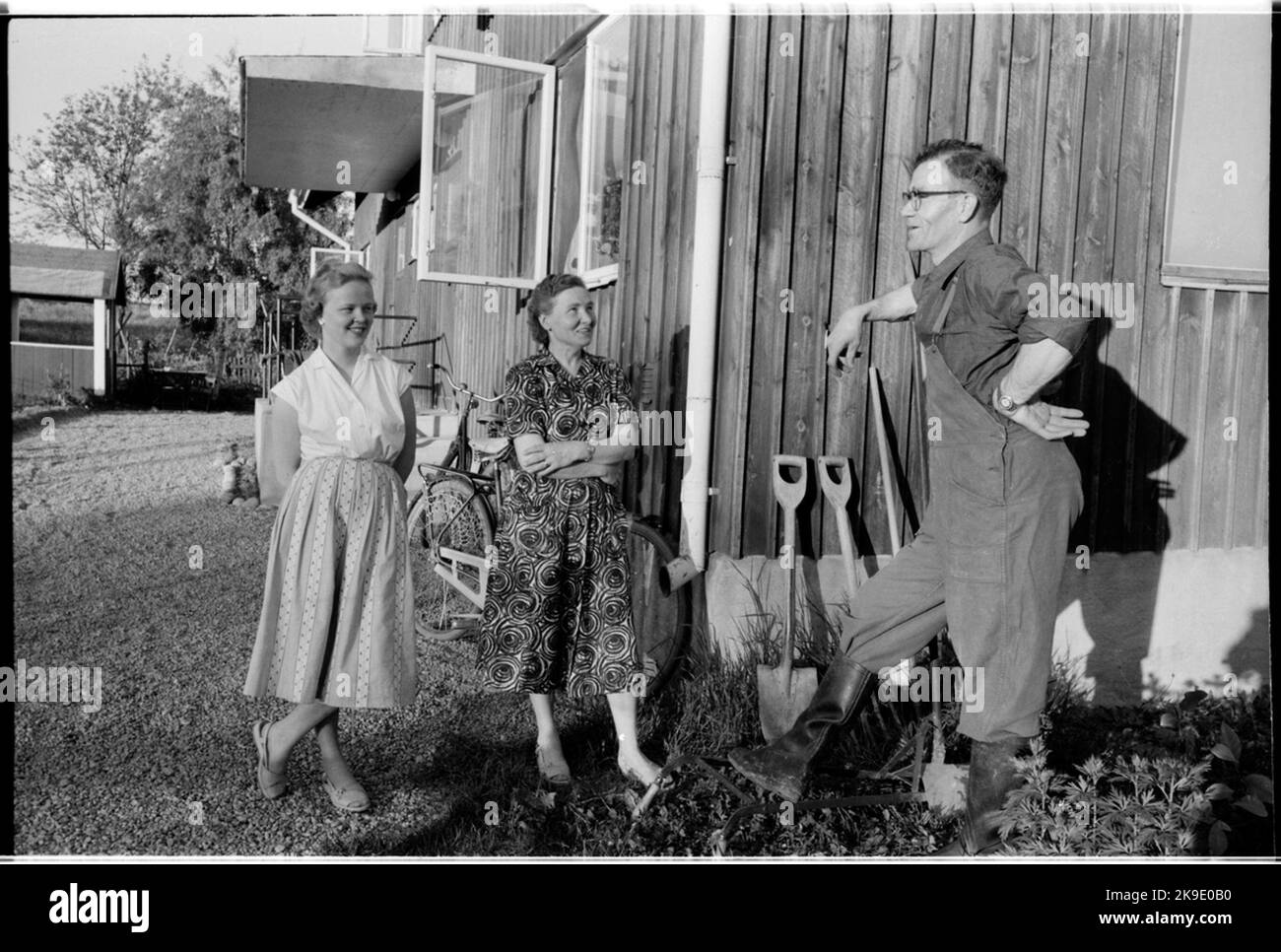 A TGOJ employee at home on his farm with his family. Traffic stock ...