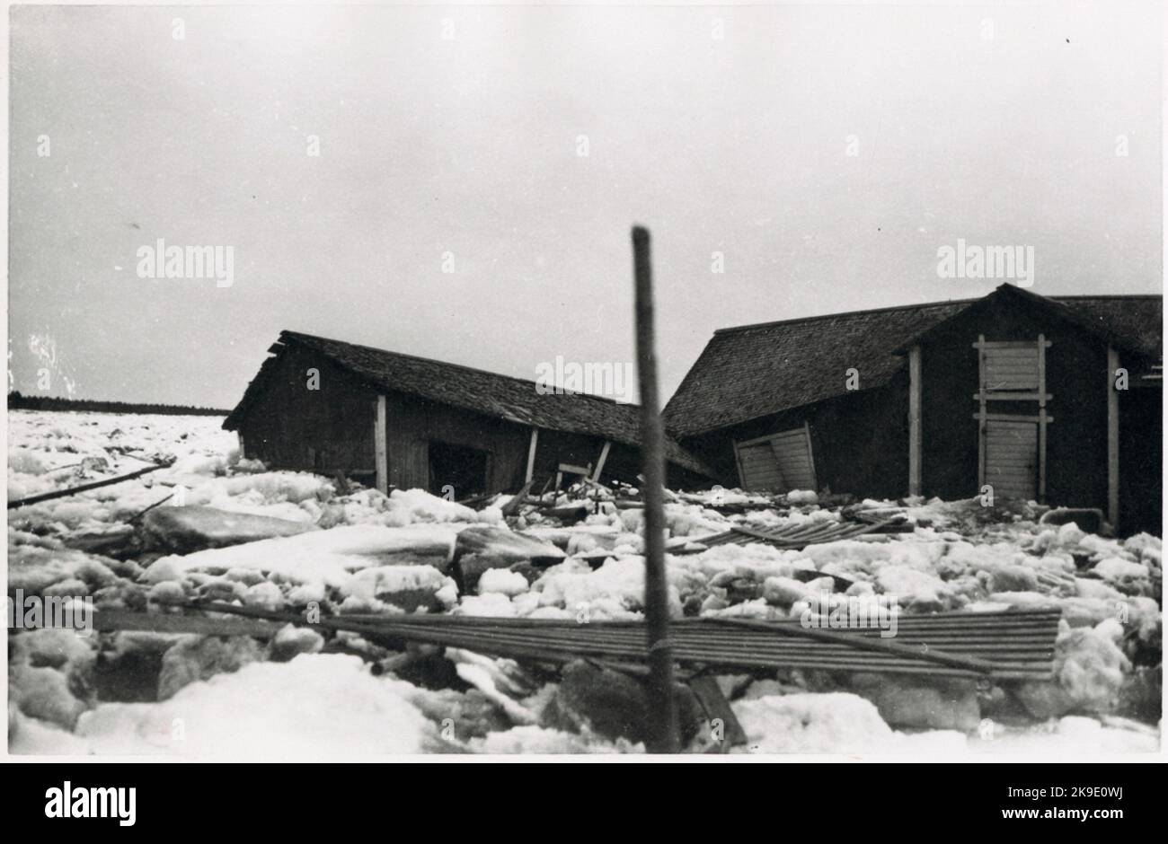 Damaged buildings and snow and ice residue after flooding in Tornedalen ...