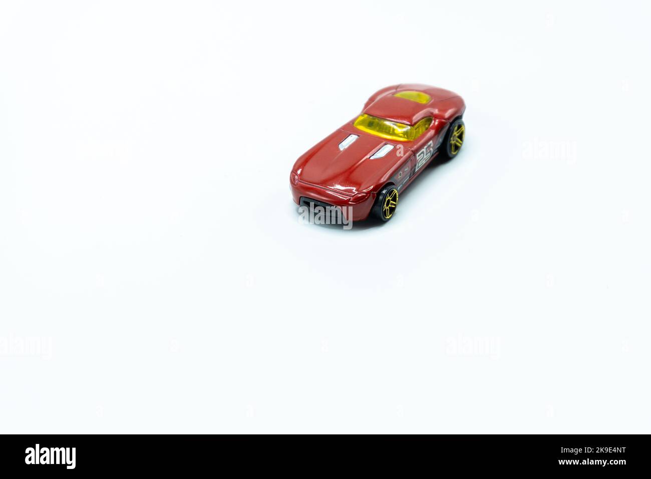 Red race car toy with yellow windshield Stock Photo - Alamy
