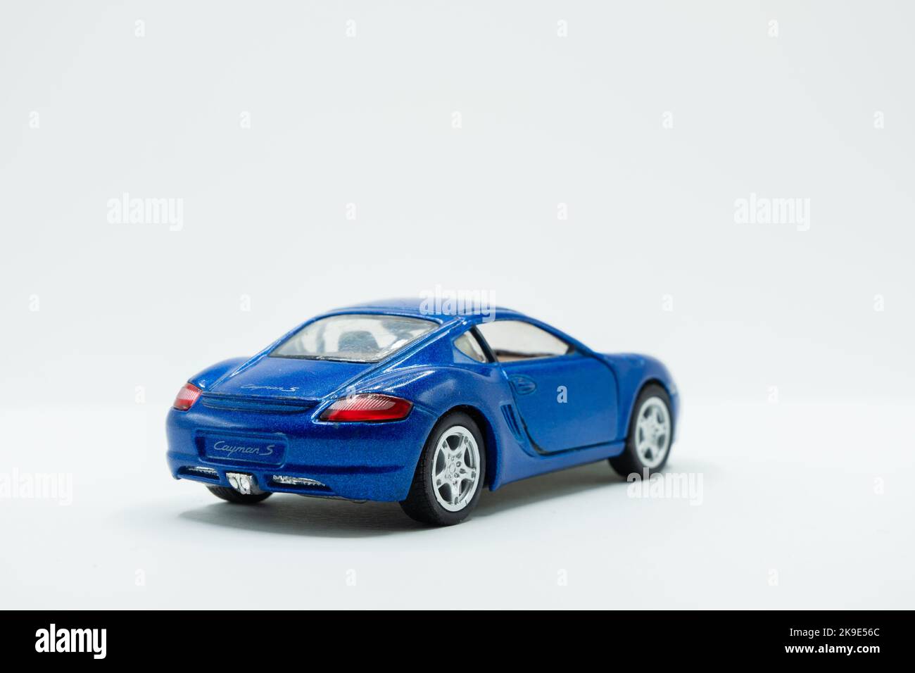 Rear view of fast blue car toy Stock Photo - Alamy